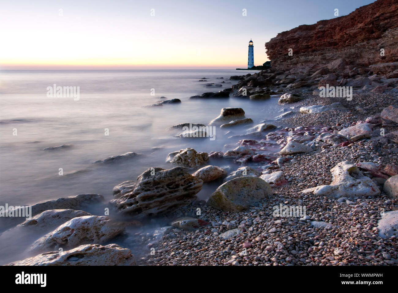 Beautiful sea beach with lighthouse and clear sky at the sunset Stock ...