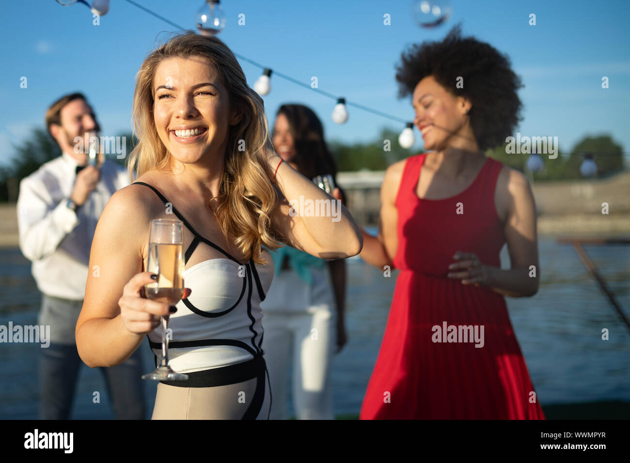 Group of friends having fun and celebrating group gathering Stock Photo ...