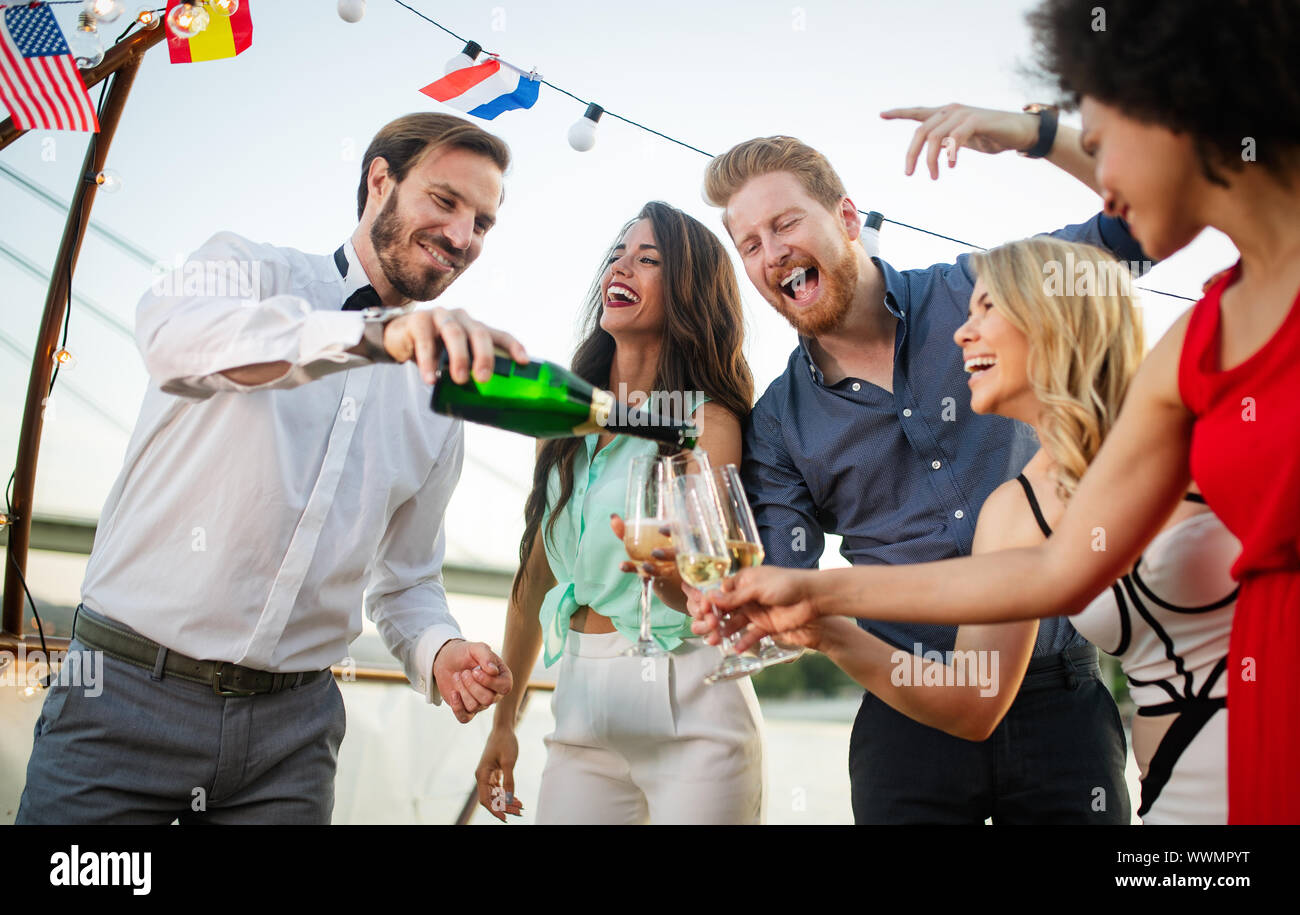 Group of happy people or friends having fun at party Stock Photo - Alamy