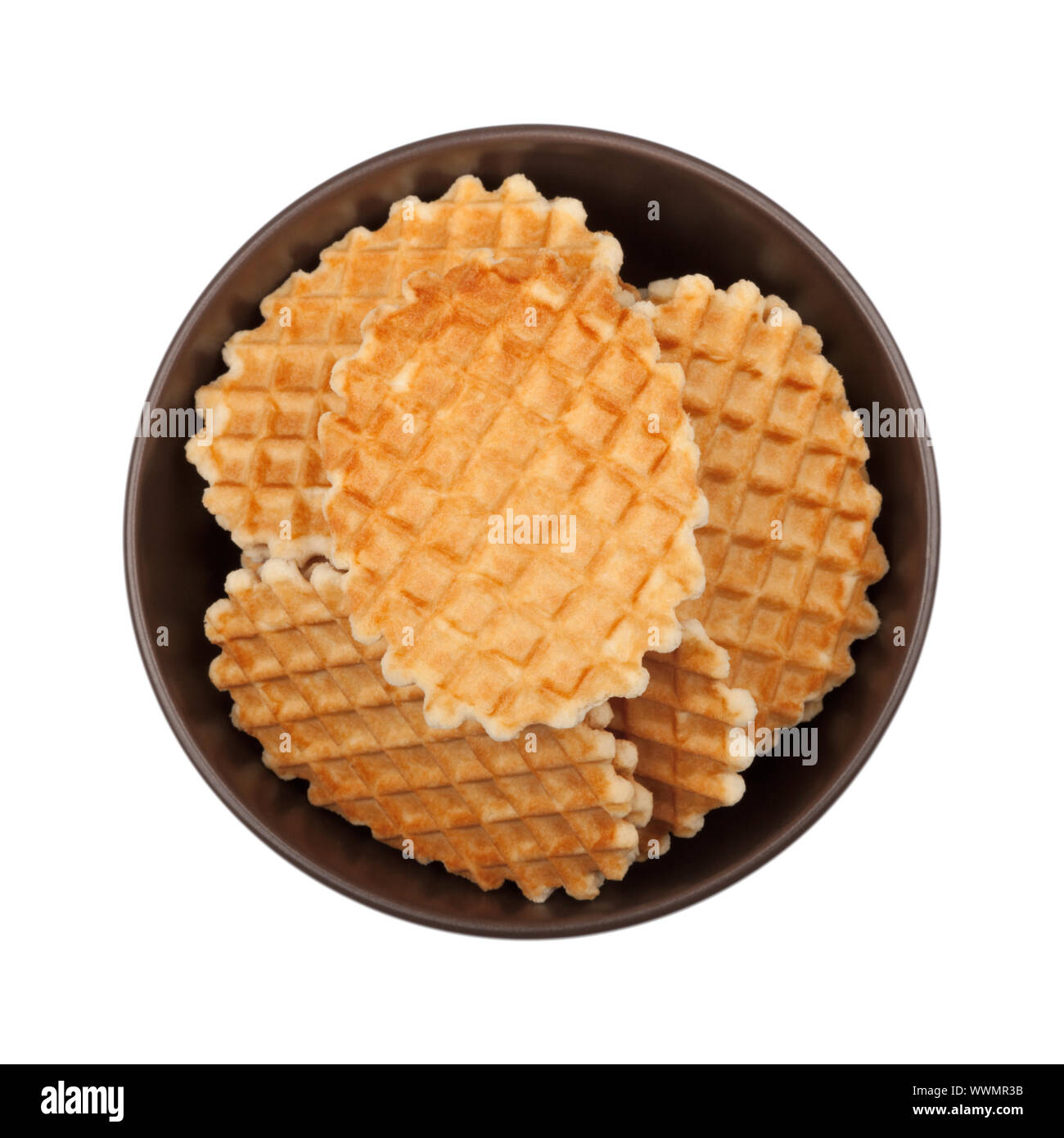 Big bowl of crunchy waffles isolated over white background Stock Photo ...