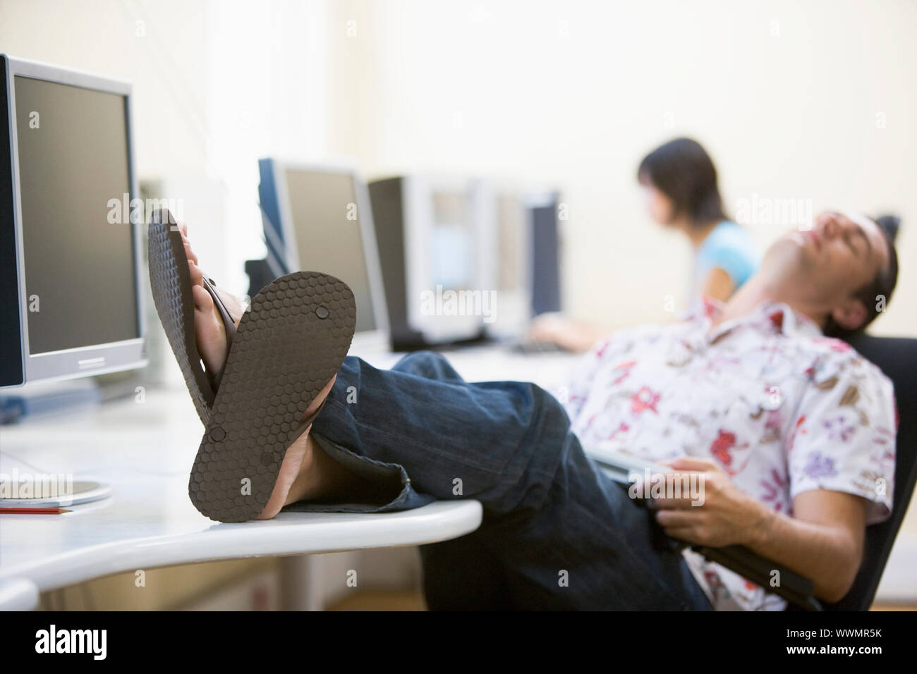 Man in computer room sleeping Stock Photo - Alamy