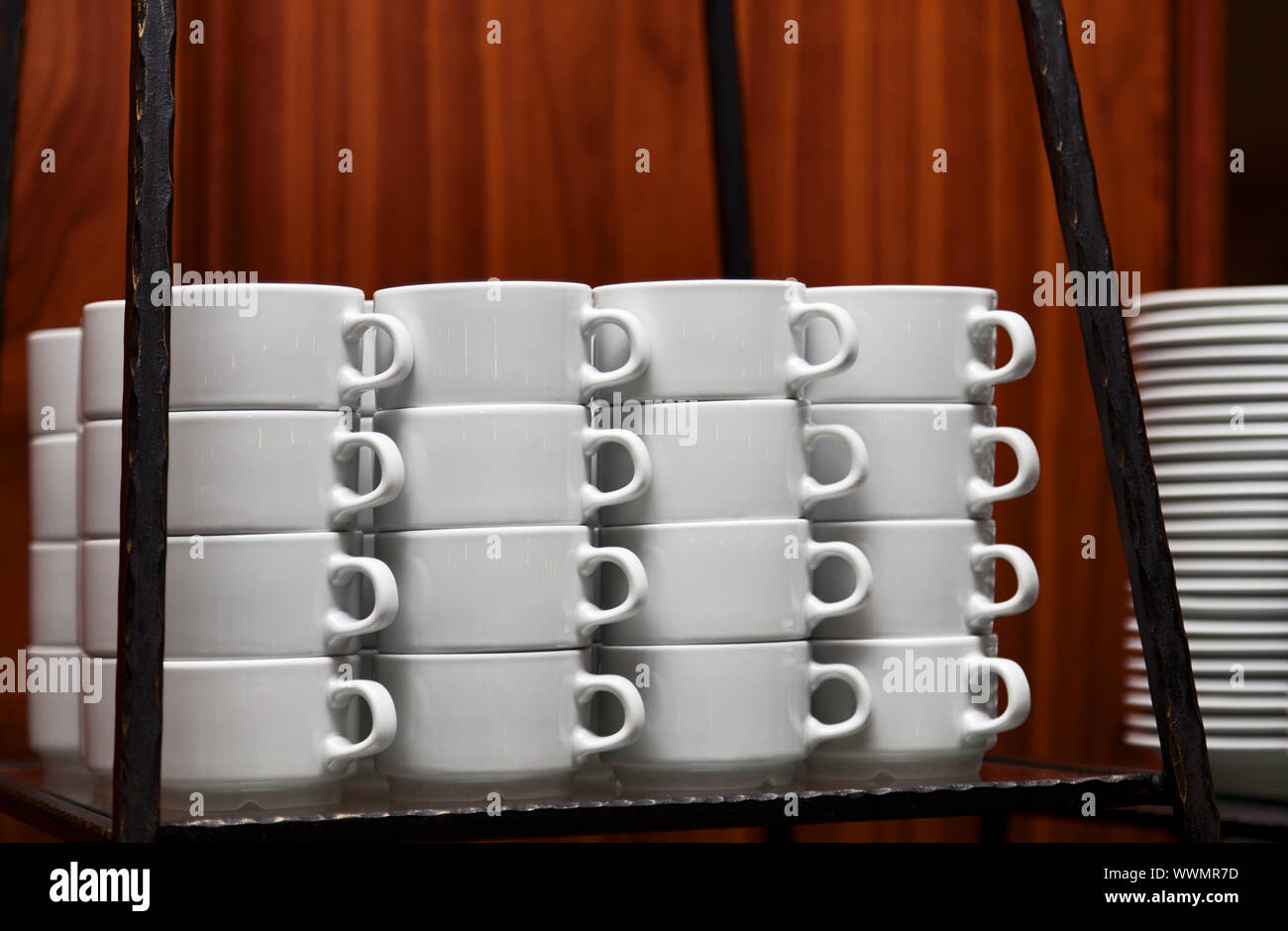 Stack of clean white ceramic cups in a restaurant kitchen Stock Photo ...