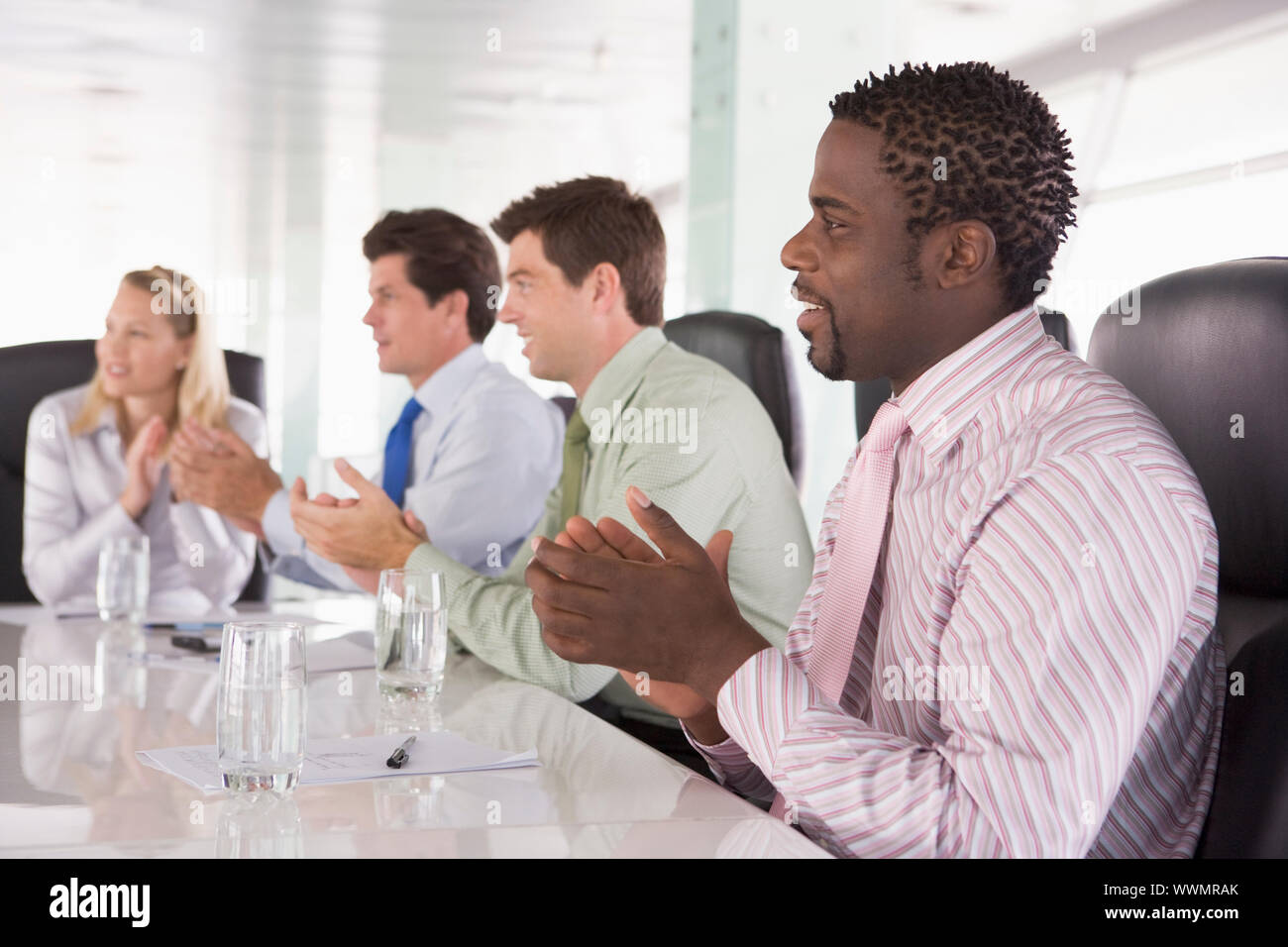 Business team clapping in boardroom hi-res stock photography and images ...