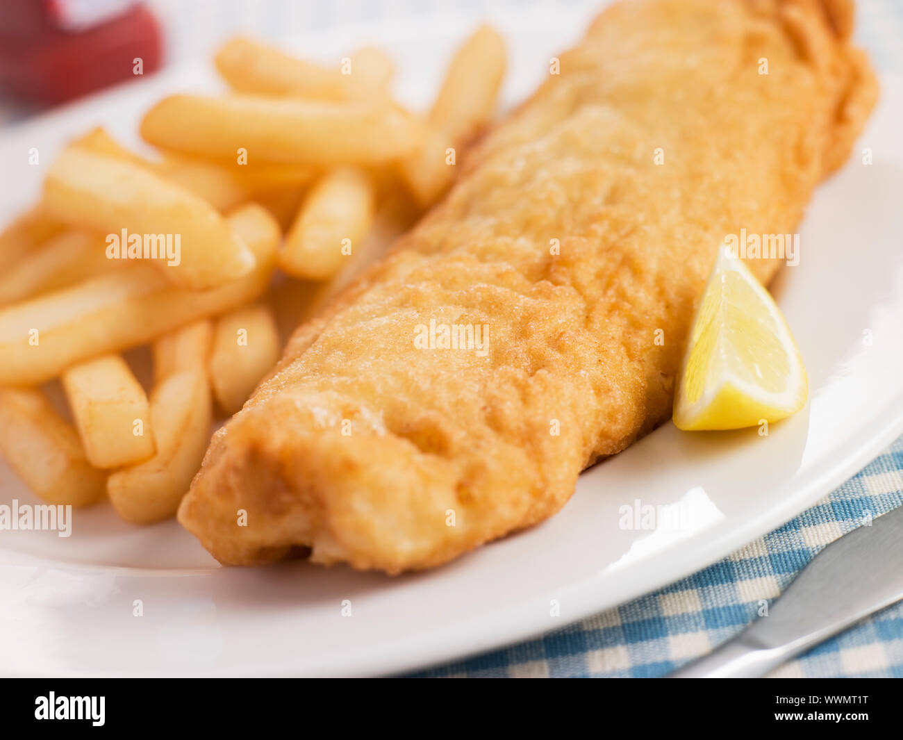Fish and Chips with Lemon and Tomato Ketchup Stock Photo - Alamy