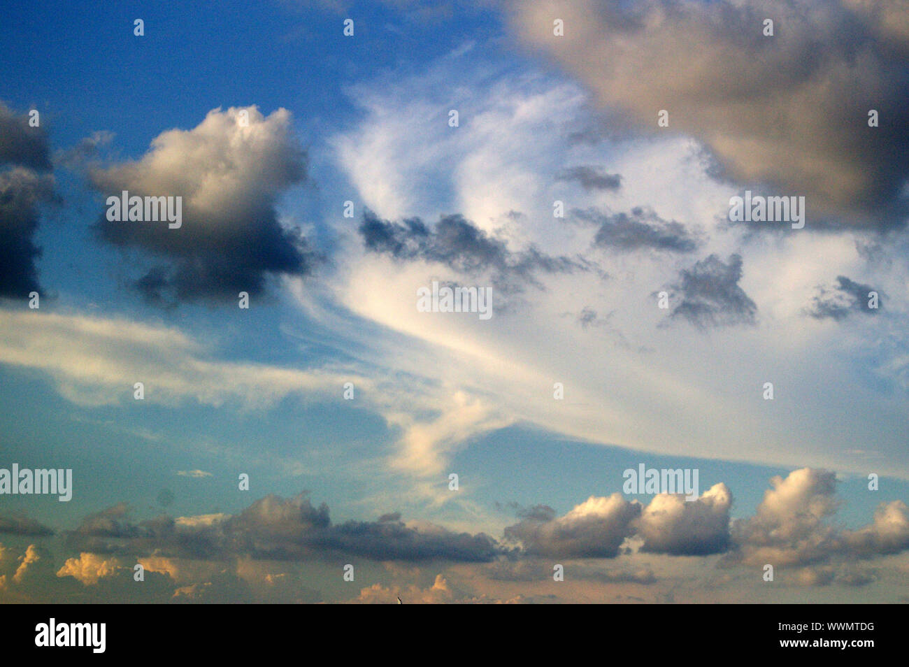 Blue sky with moving clouds background Stock Photo - Alamy