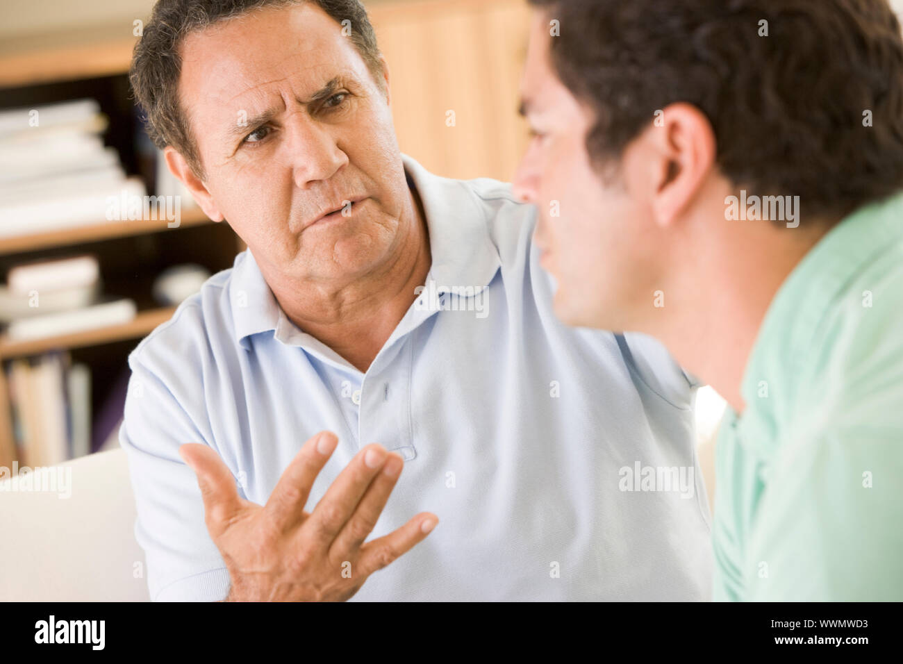 Two men chatting in the living room hi-res stock photography and images ...