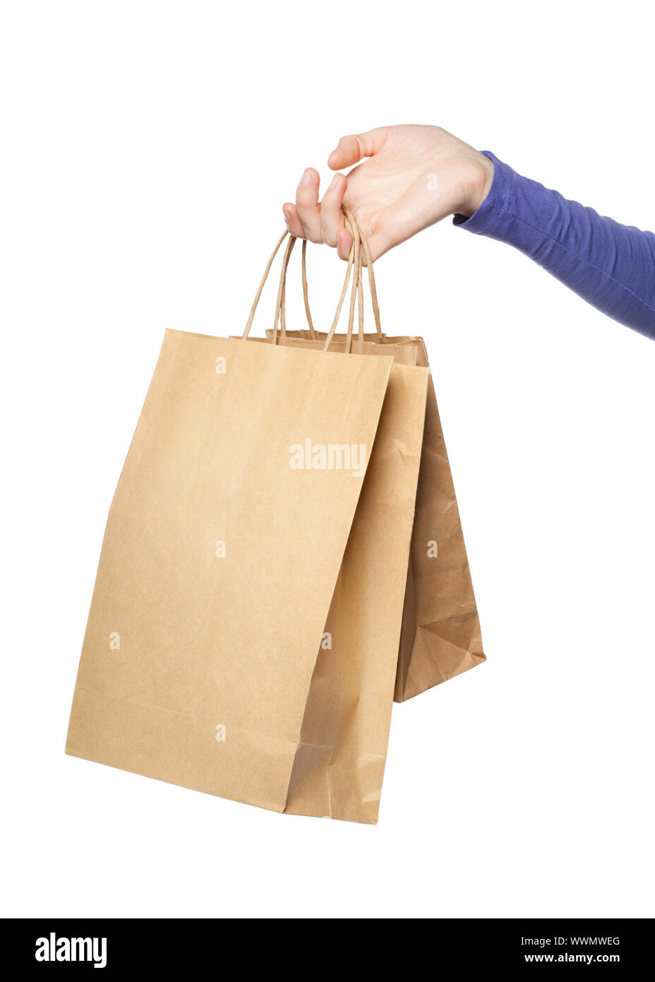 Two paper bags in a woman hand isolated over white background Stock ...