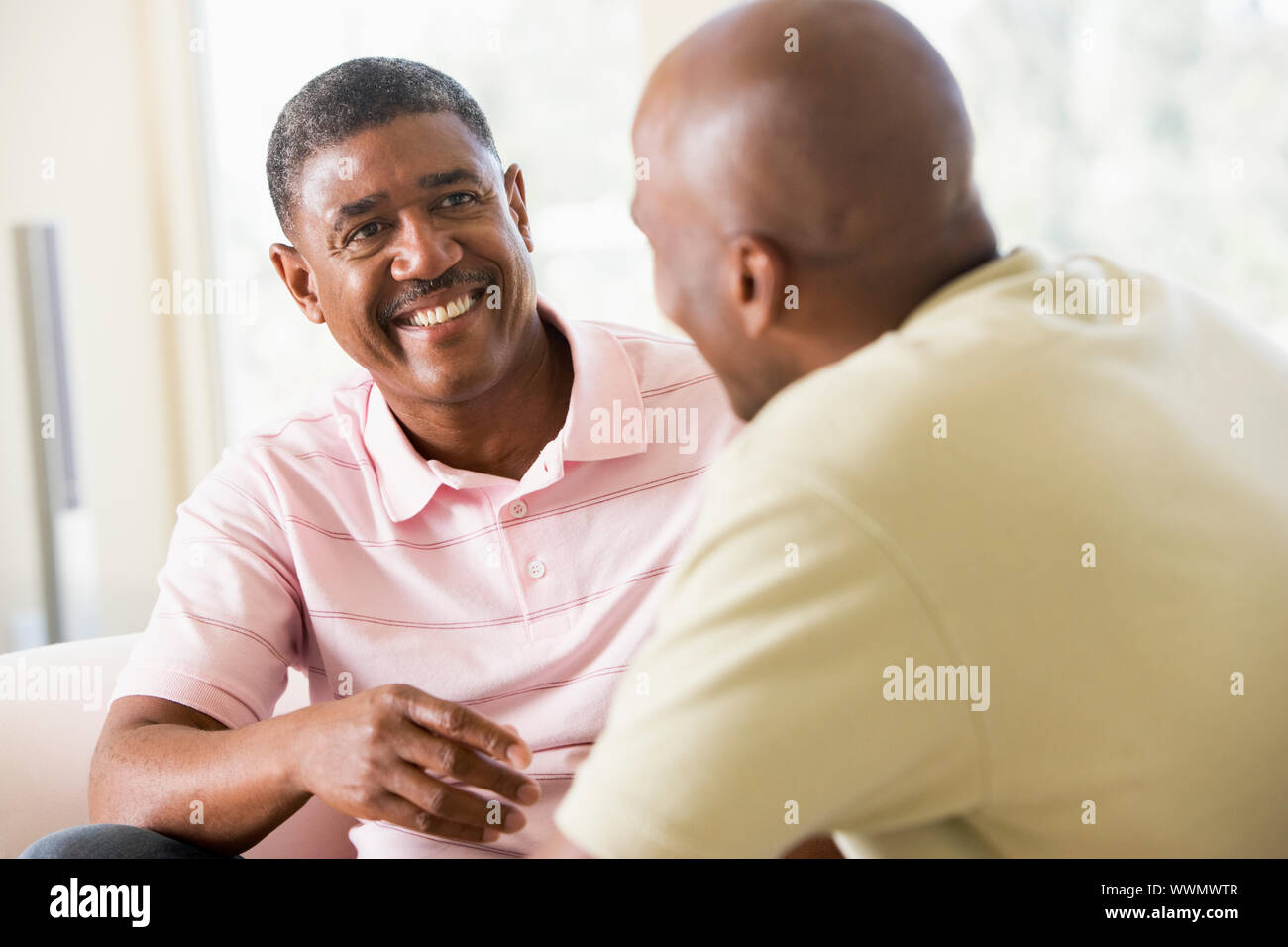 Two men chatting in the living room hi-res stock photography and images ...