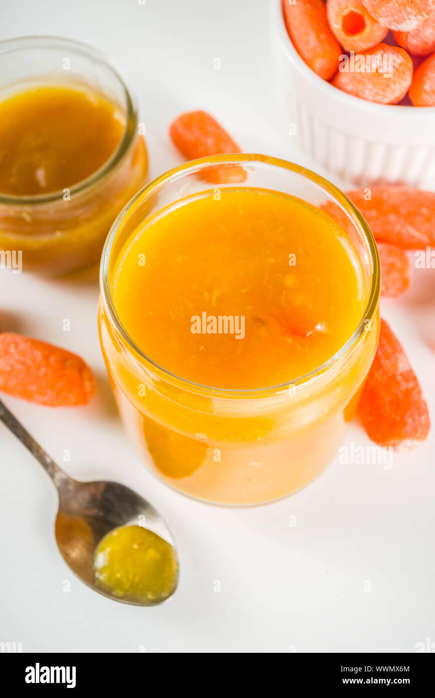 Homemade carrot jam with fresh baby carrots, copy space Stock Photo - Alamy