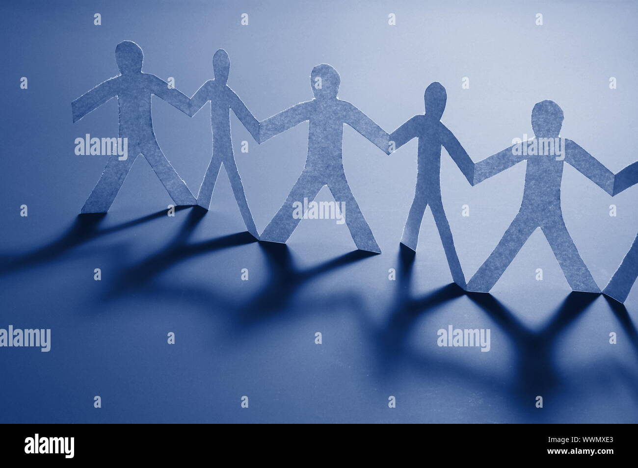 paper people doing teamwork in their business Stock Photo - Alamy