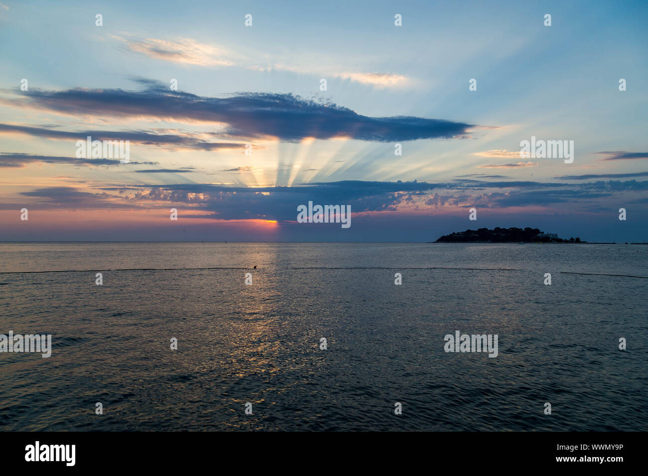 Sunset and sun rays at dusk in Croatia Stock Photo - Alamy
