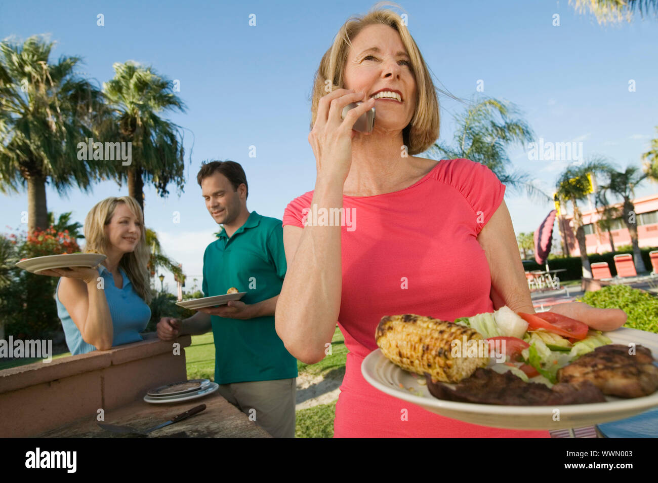 Family Having Cookout Stock Photo - Alamy