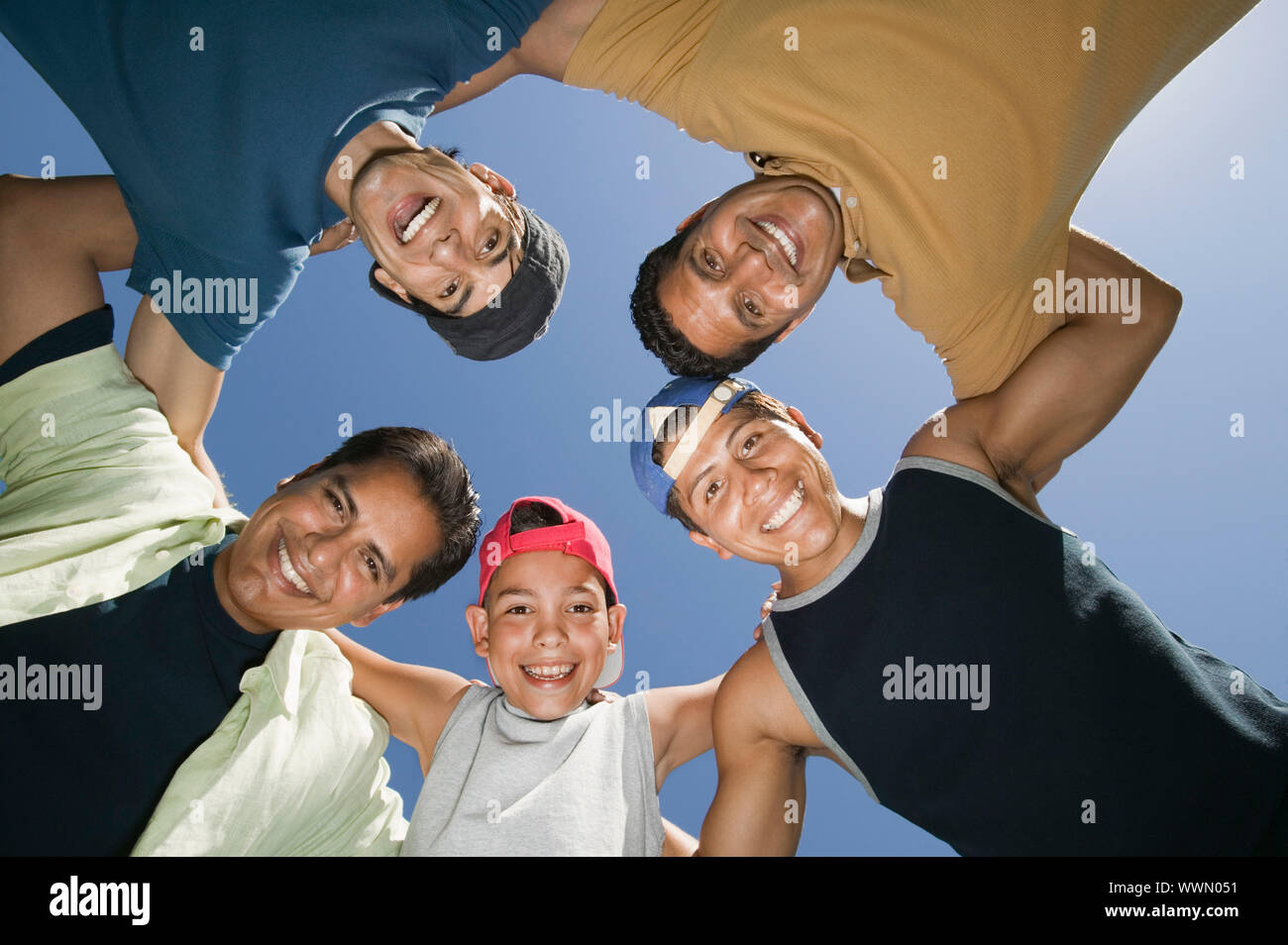 Men in a Huddle Stock Photo - Alamy
