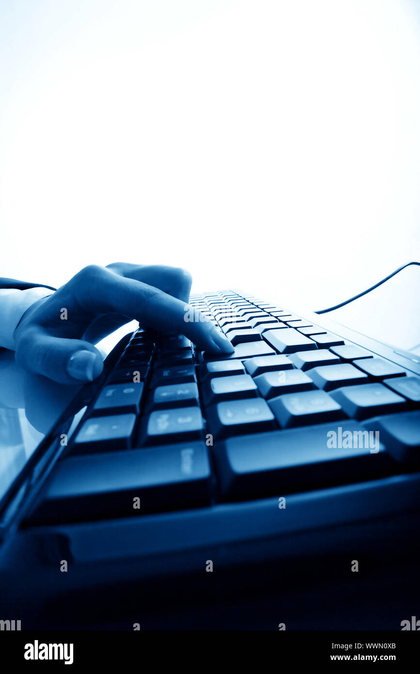 hand press a key on keyboard Stock Photo - Alamy