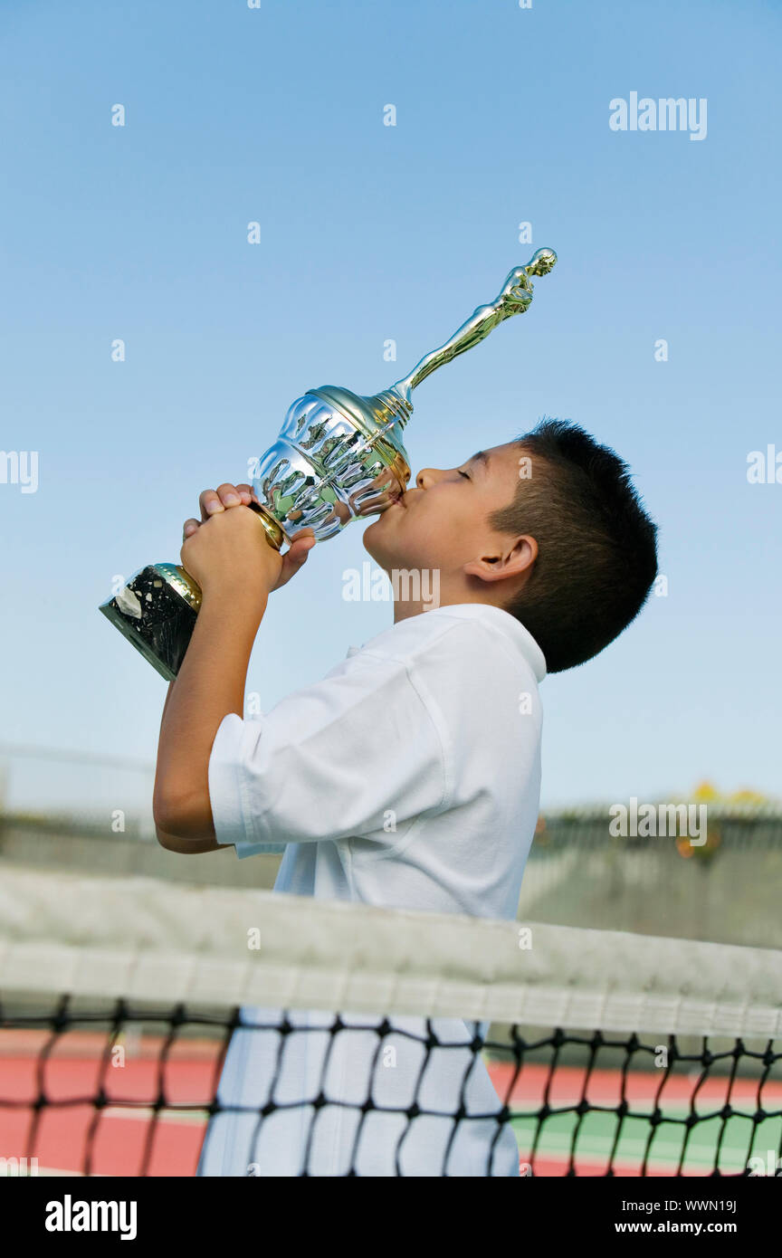 Tennis Player Kissing Trophy Stock Photo - Alamy