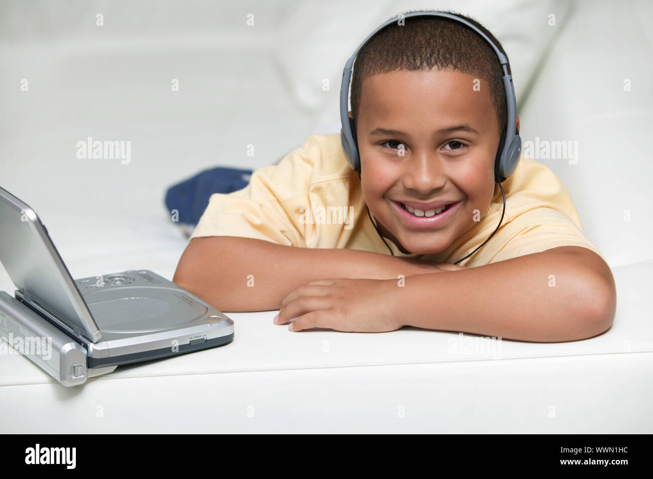 Smiling Boy Watching Portable DVD Player Stock Photo - Alamy
