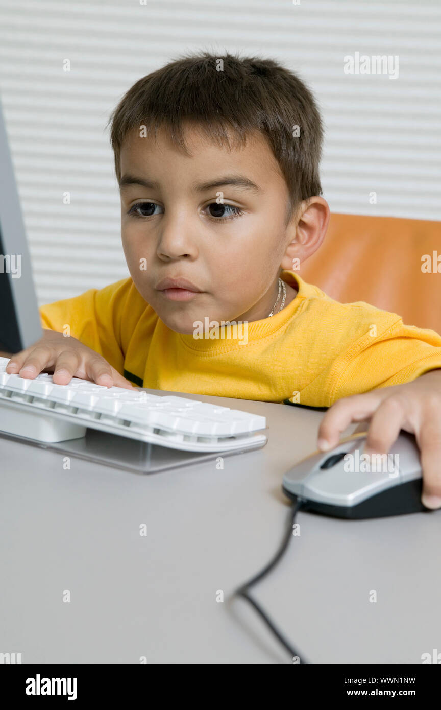 Boy Using Computer Stock Photo - Alamy