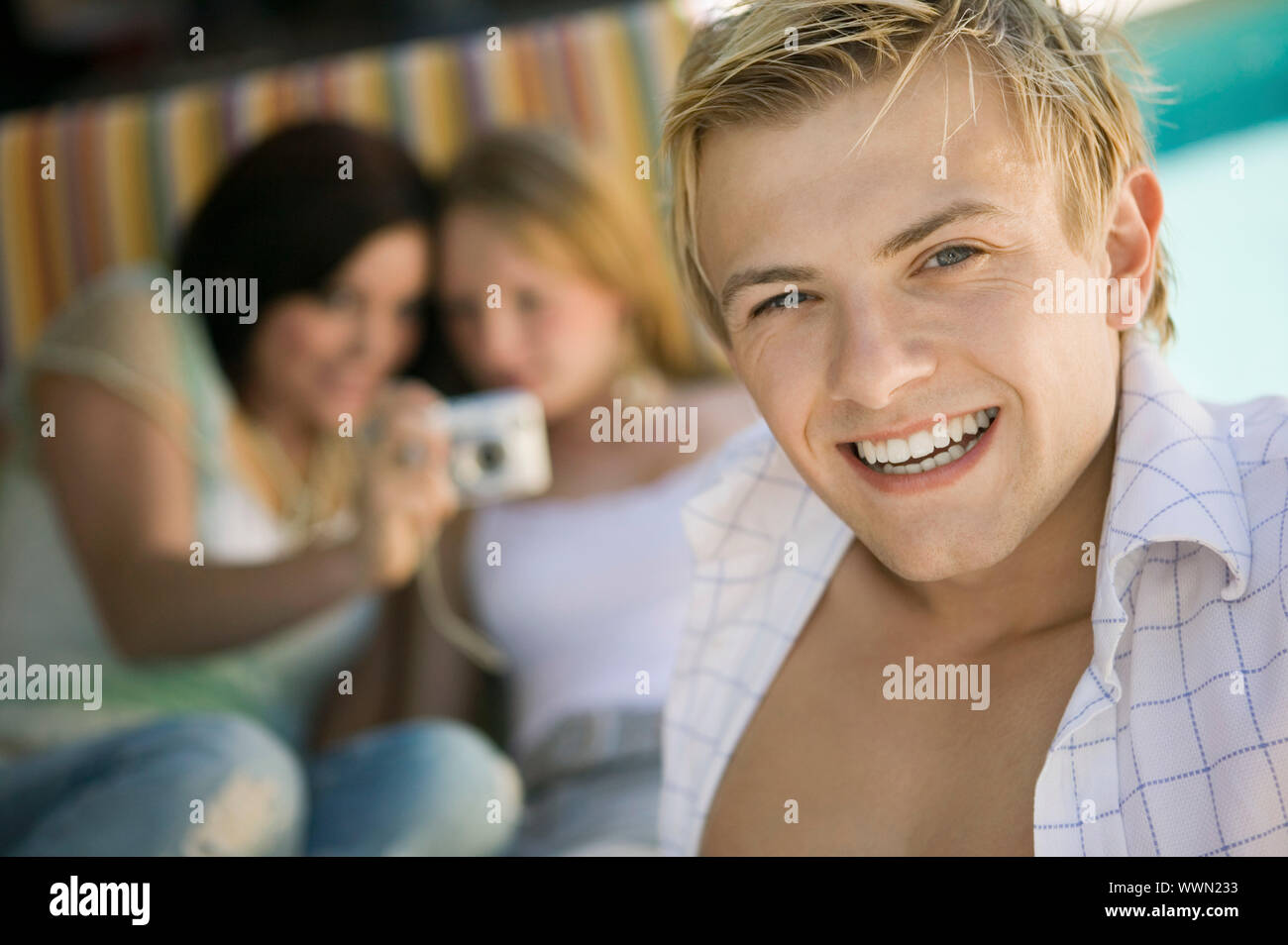 Young Man Hanging Out with Friends Stock Photo - Alamy