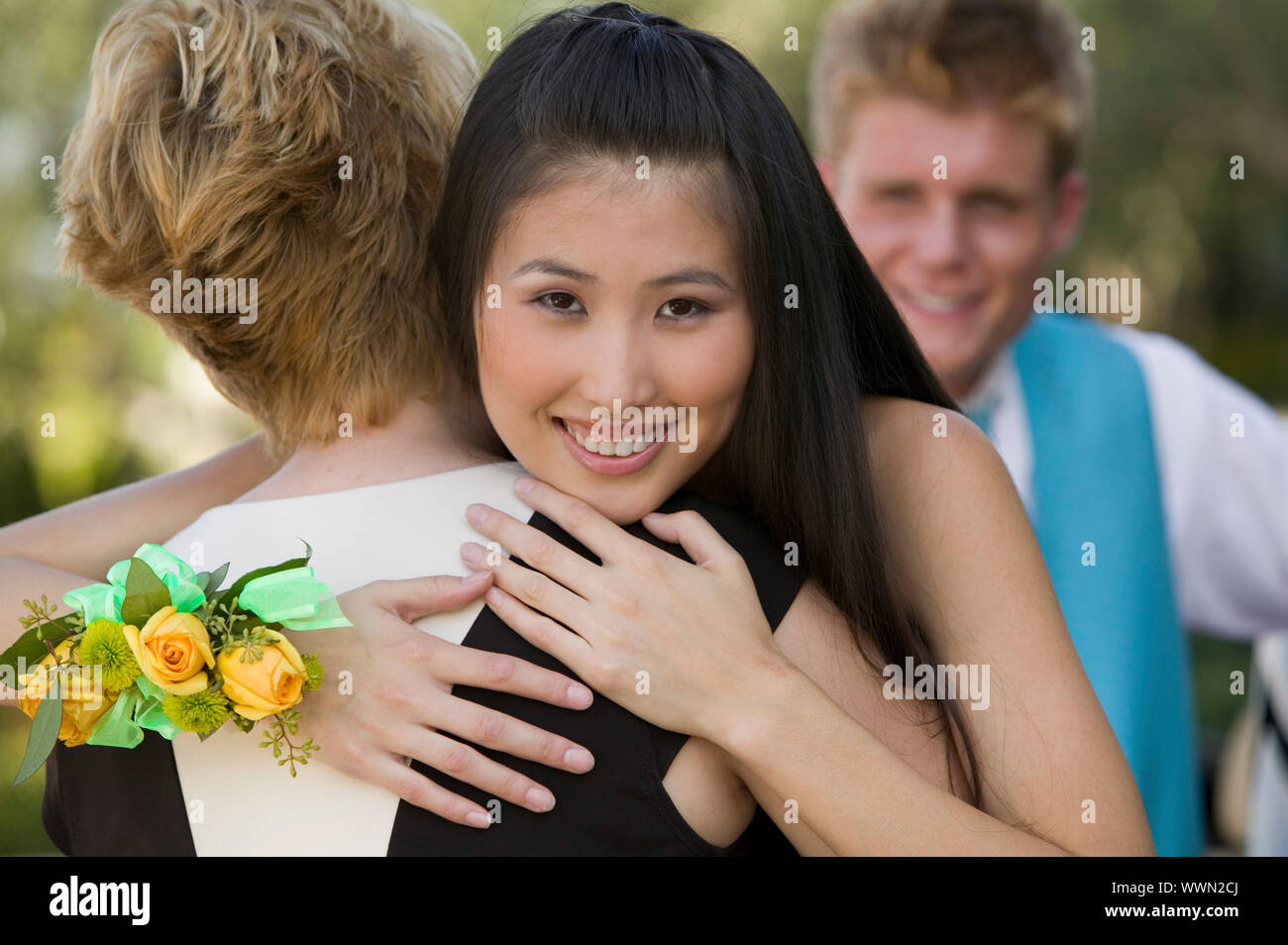 Teenage Girl Hugging Friend at Dance Stock Photo - Alamy