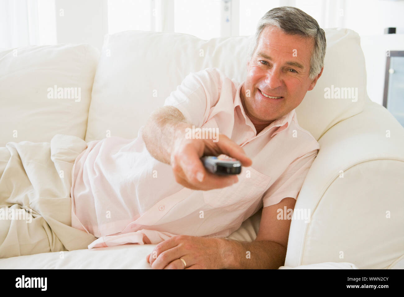 Person using tv remote hi-res stock photography and images - Alamy