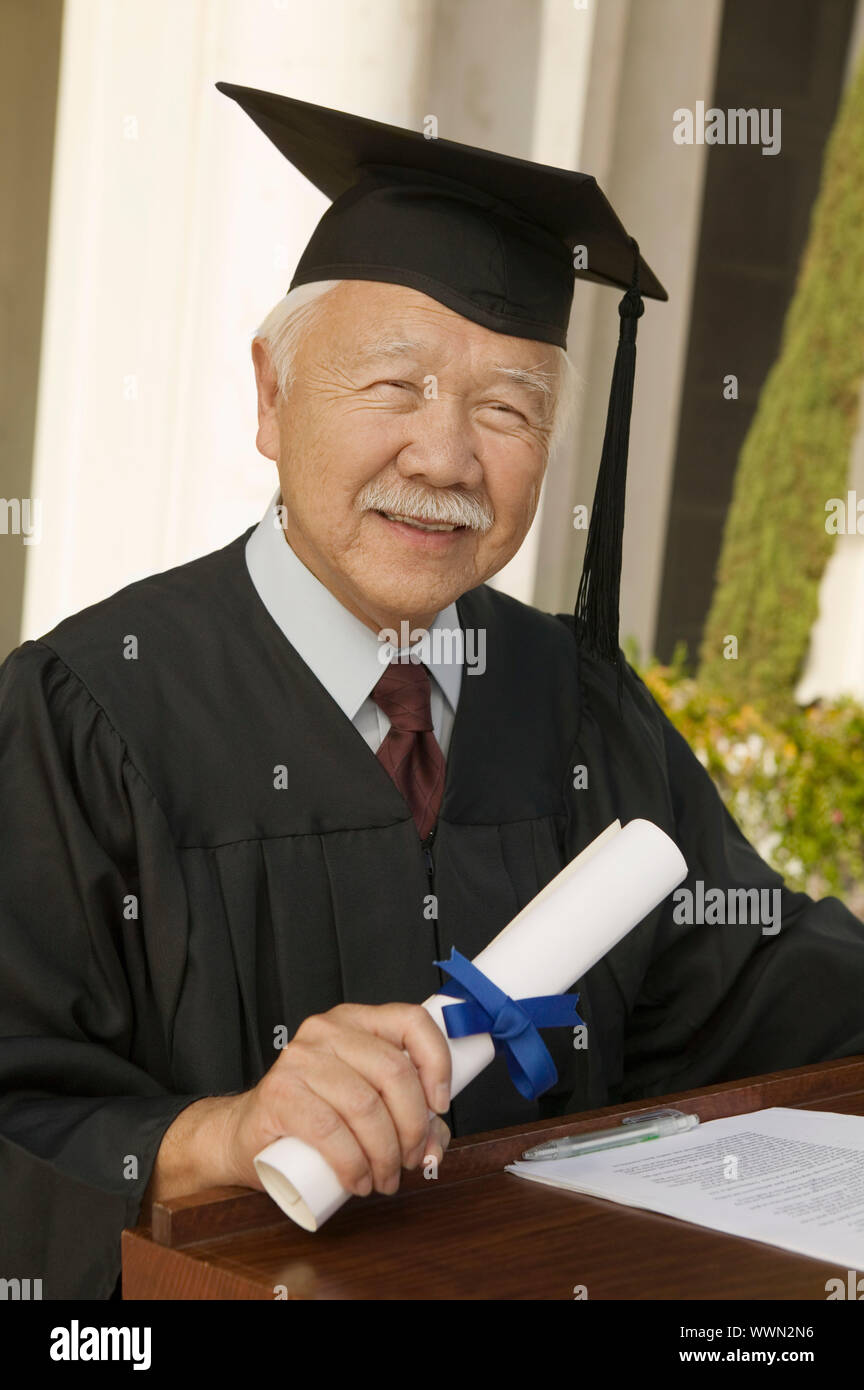 Senior Graduate with Diploma Stock Photo - Alamy