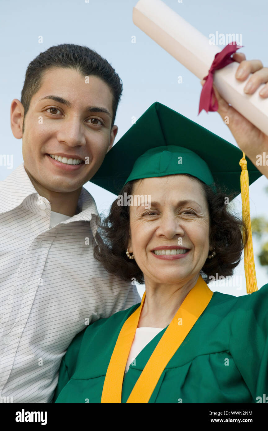 Graduate Mother with Son Stock Photo - Alamy