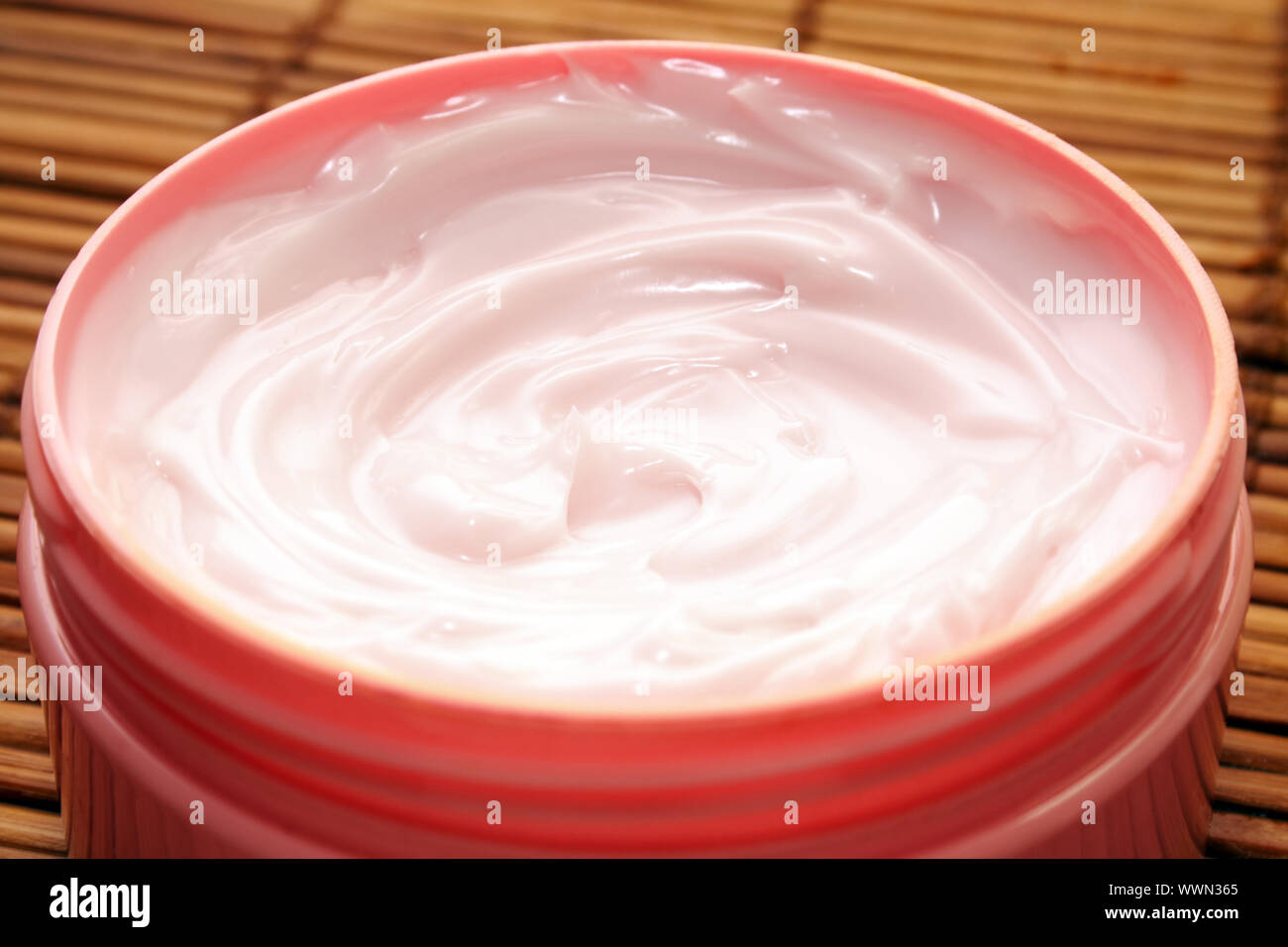 cosmetic cream against a background of bamboo Stock Photo - Alamy