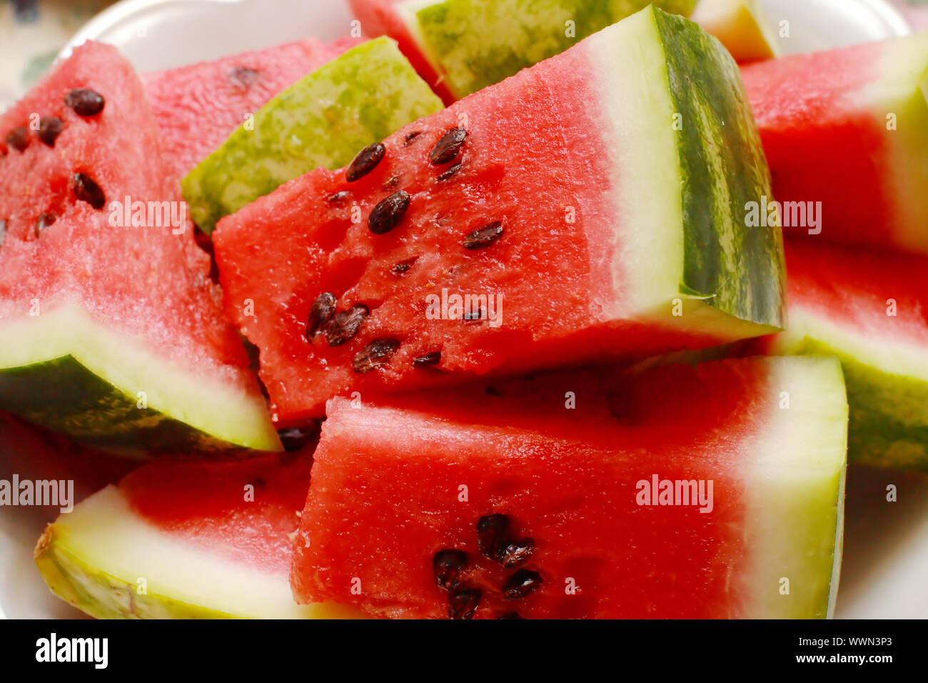 Juicy watermelon. Background of brightly lit watermelon slices Stock ...