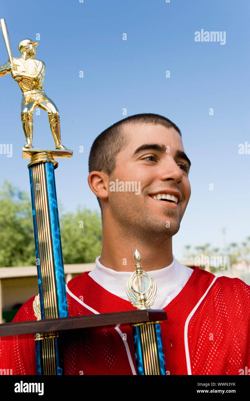 Baseball Player Holding Trophy Stock Photo - Alamy