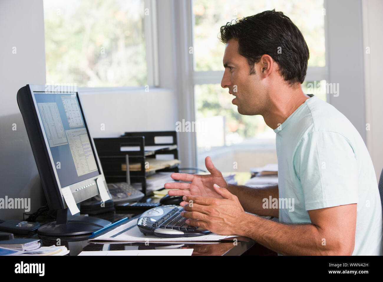 Annoyed person typing computer hi-res stock photography and images - Alamy