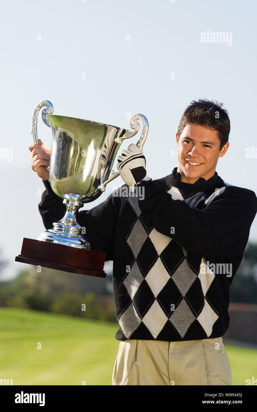 Golfer holding trophy portrait hi-res stock photography and images - Alamy