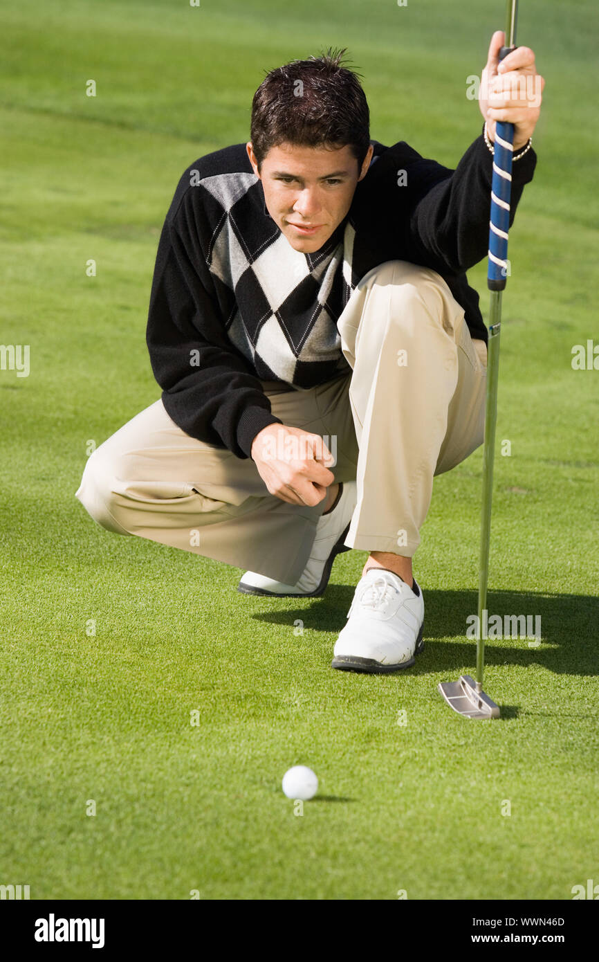 Golfer Lining Up Putt Stock Photo - Alamy