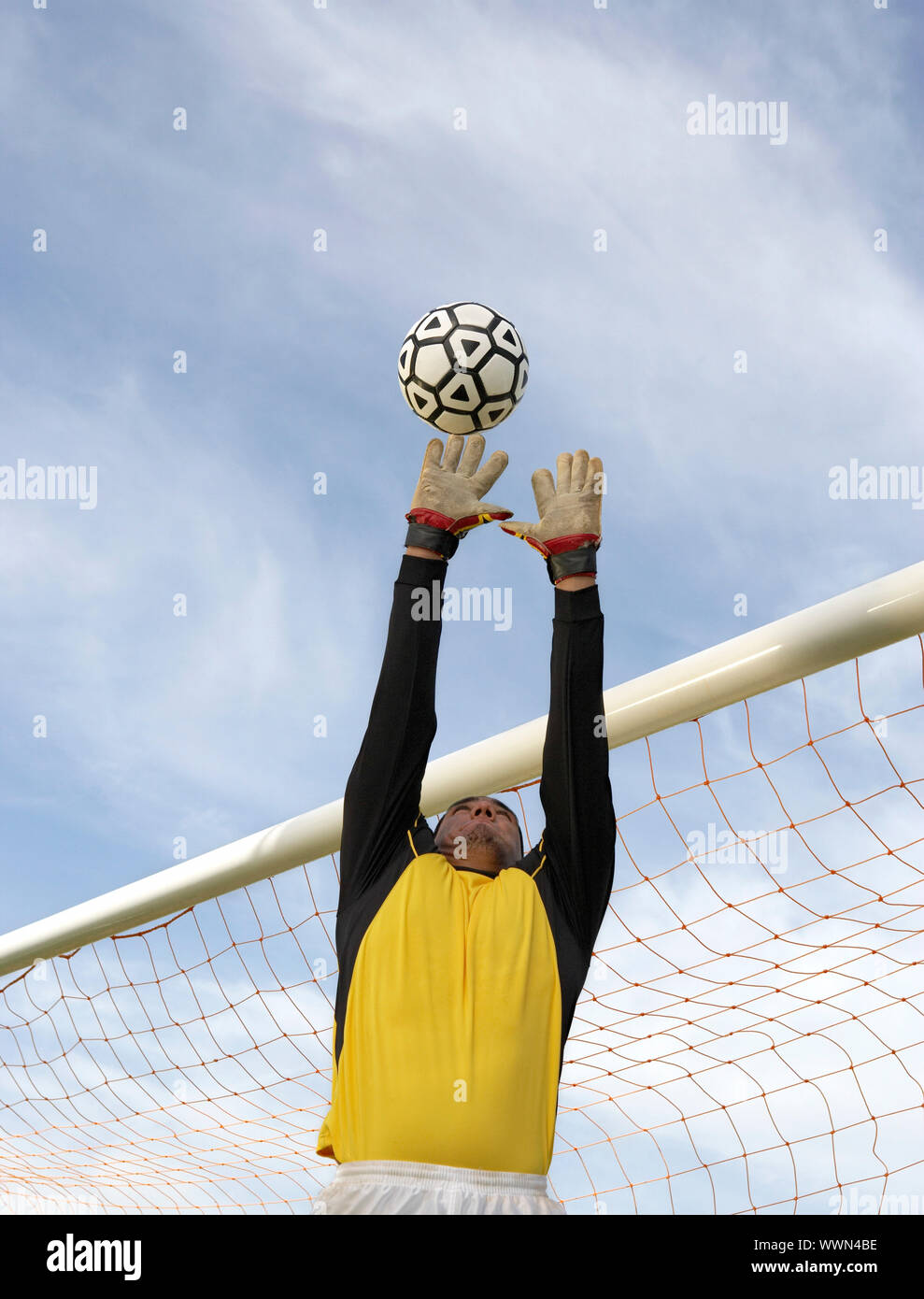 Soccer Goalkeeper Catching Ball Stock Photo - Alamy