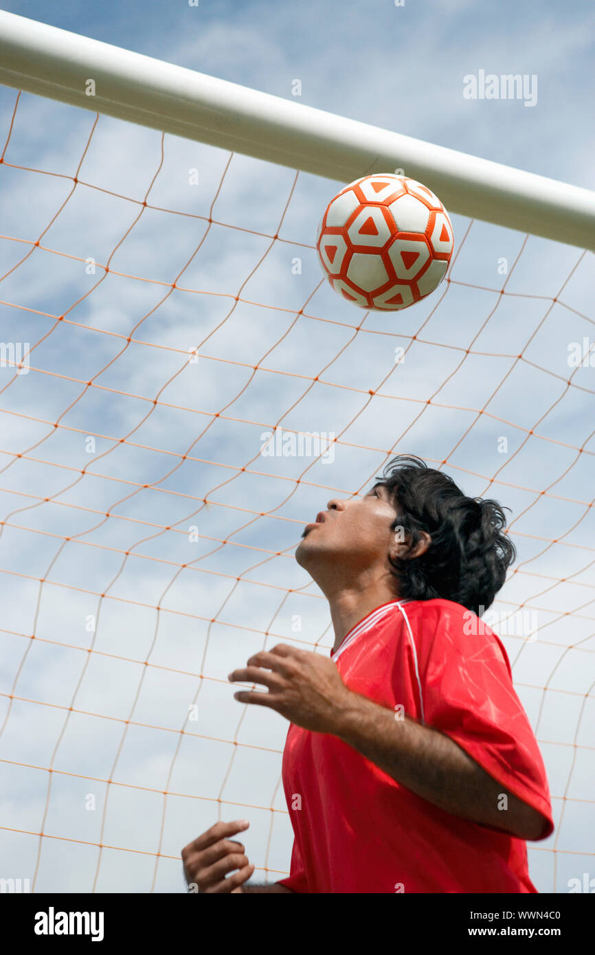 Soccer Player Heading a Ball Stock Photo - Alamy