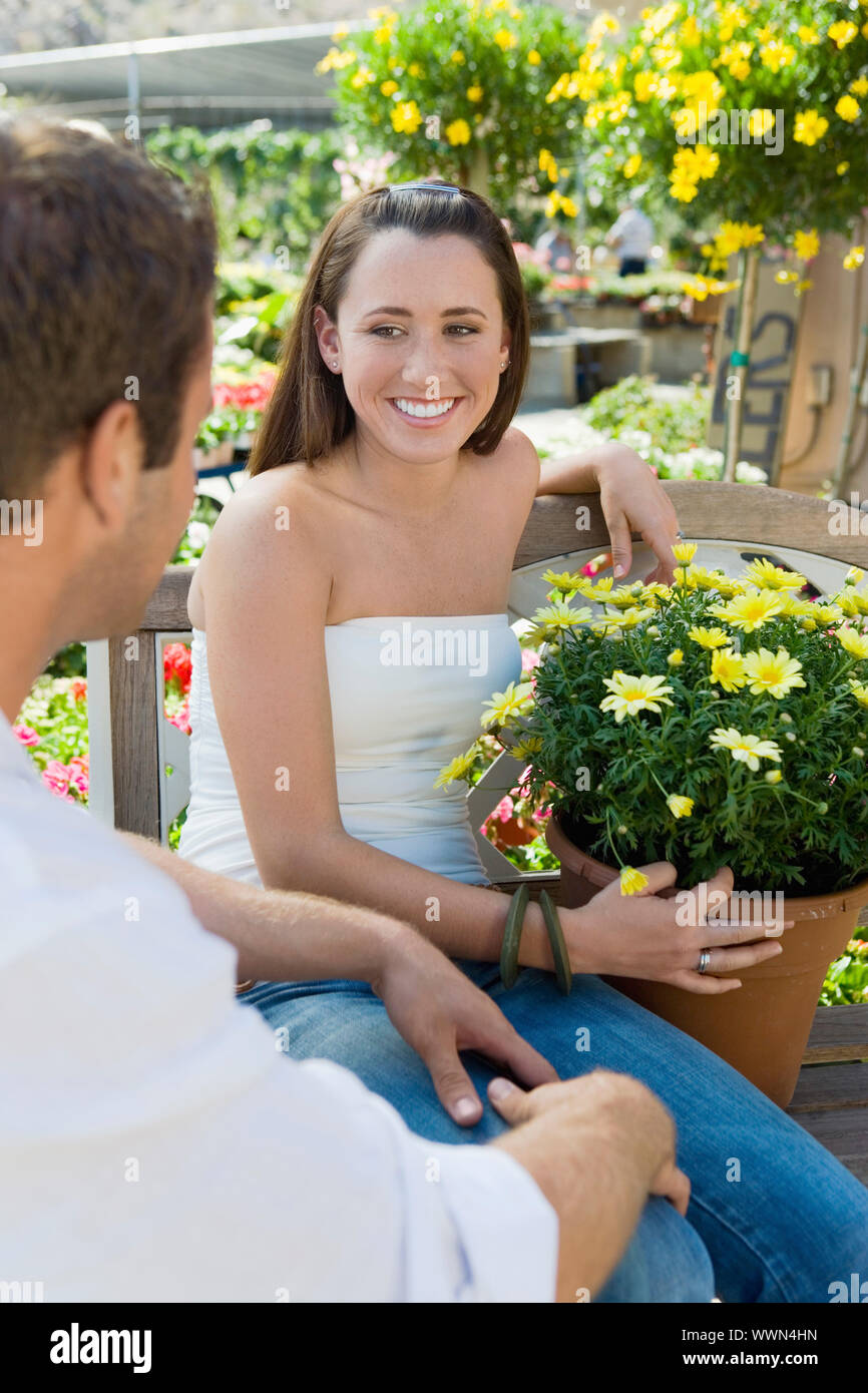 Couple with Potted Plant Stock Photo - Alamy