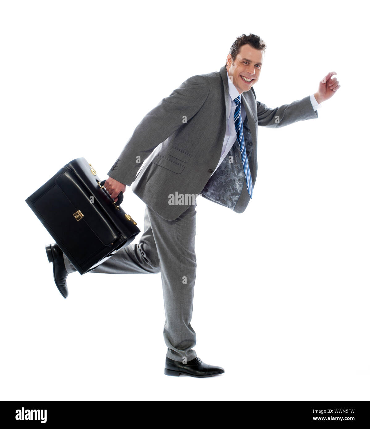 Full length portrait of a businessman running away against white ...
