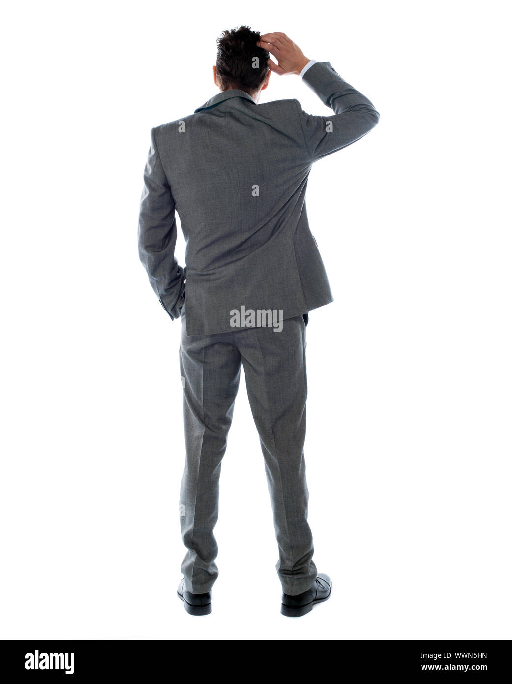 Back-pose of a corporate person thinking. Isolated over white ...
