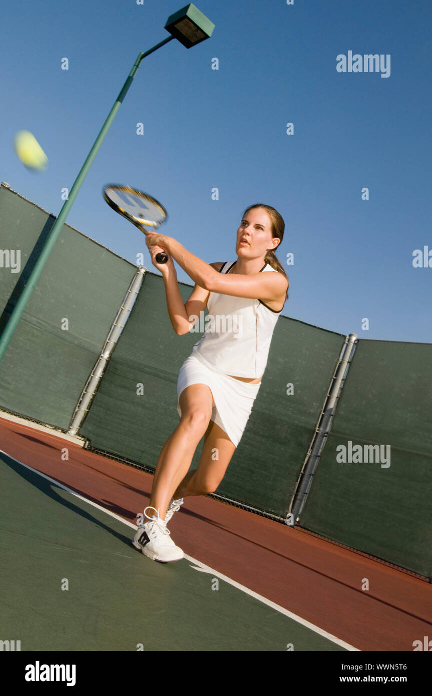 Tennis Player Hitting Backhand Stock Photo - Alamy