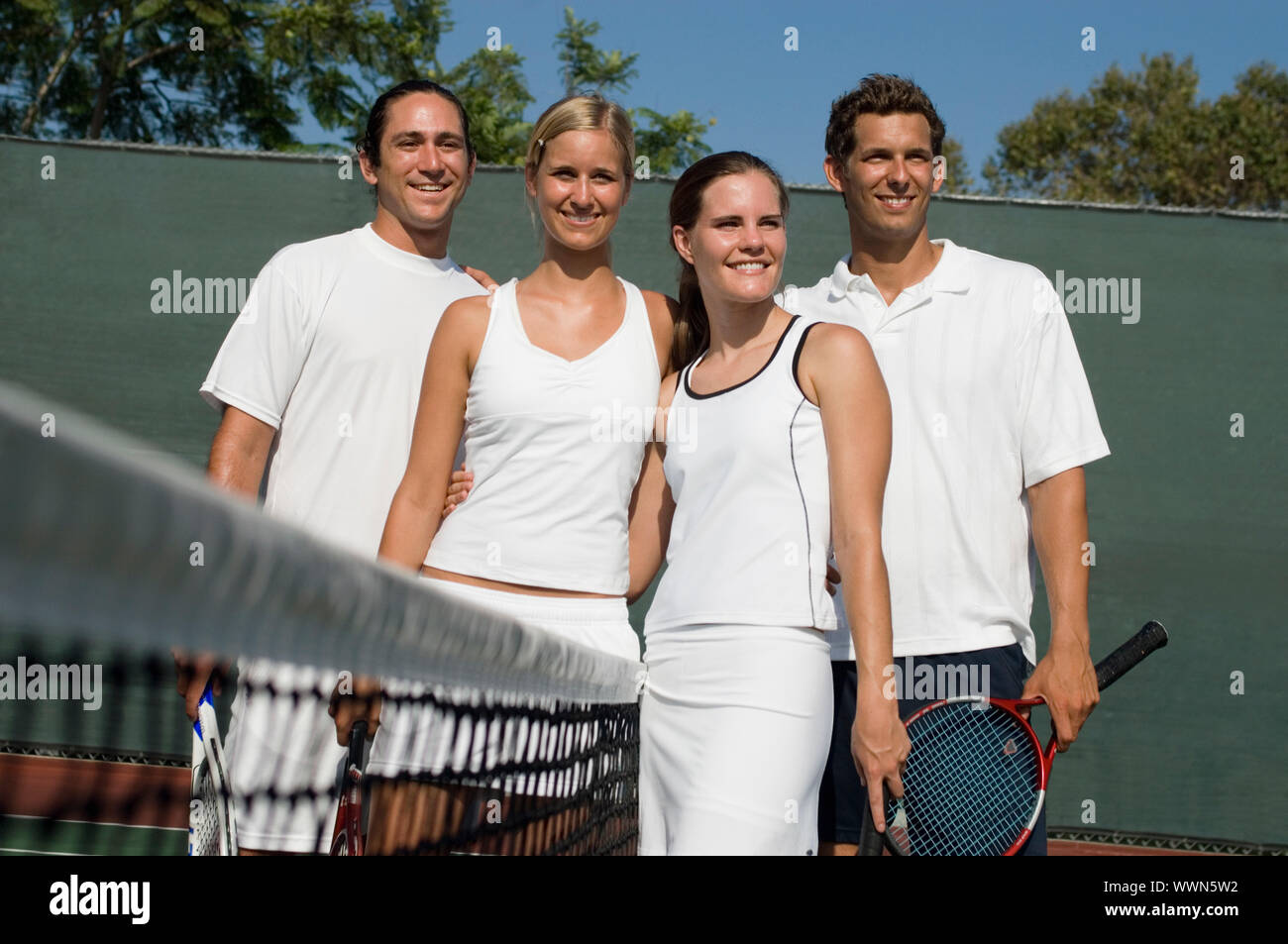 Mixed Doubles Tennis Players at Net Stock Photo - Alamy