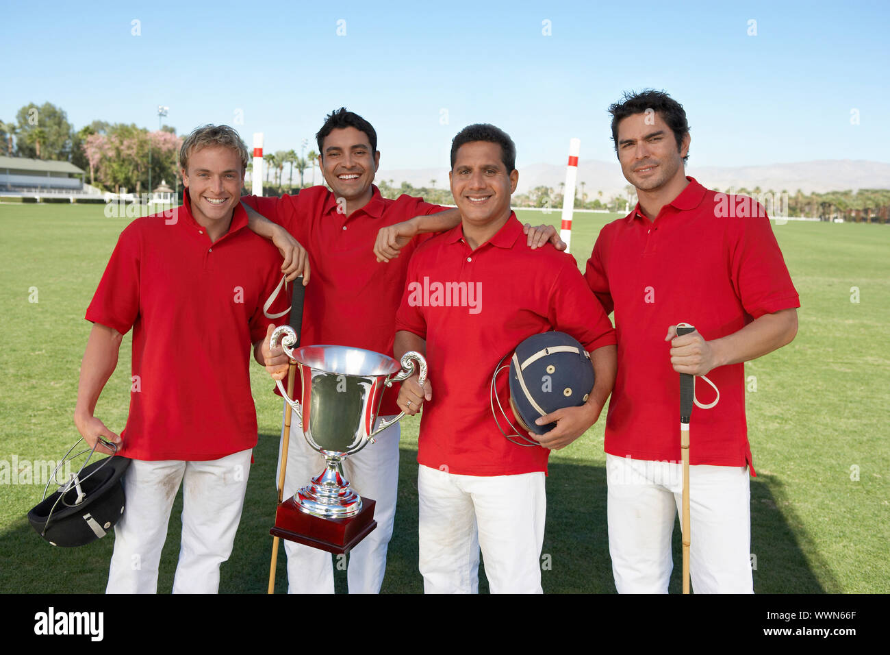 Polo Players with Trophy Stock Photo - Alamy