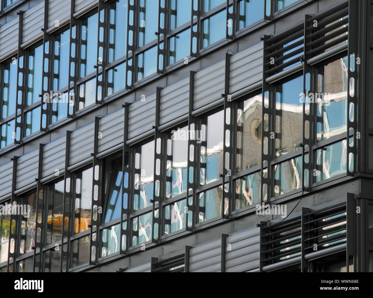 Reflection on a glass facade Stock Photo - Alamy