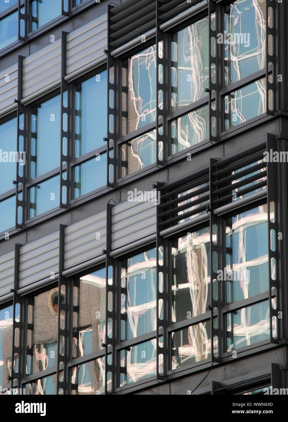 Reflection on a glass facade Stock Photo - Alamy