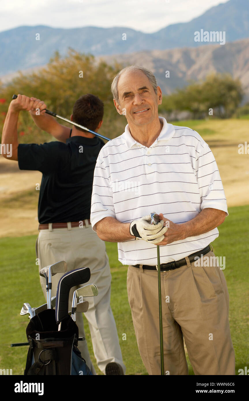 Two Men on Golf Course Stock Photo - Alamy