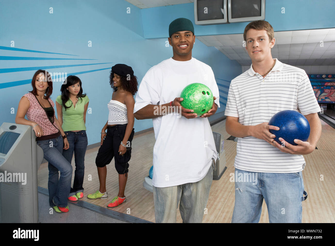 Group of Friends in Bowling Alley Stock Photo - Alamy