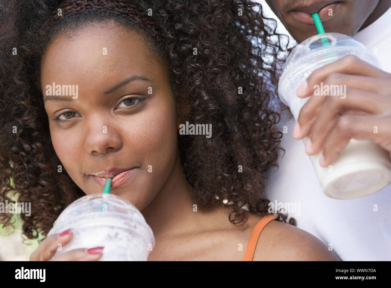Woman sipping milkshake hi-res stock photography and images - Alamy