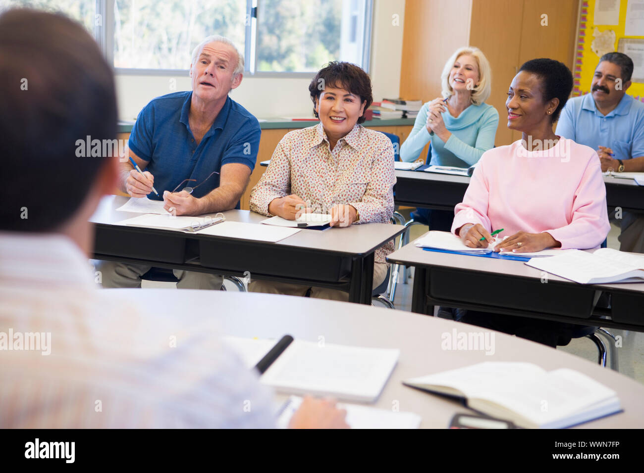 Mature students and their teacher in a classroom Stock Photo - Alamy