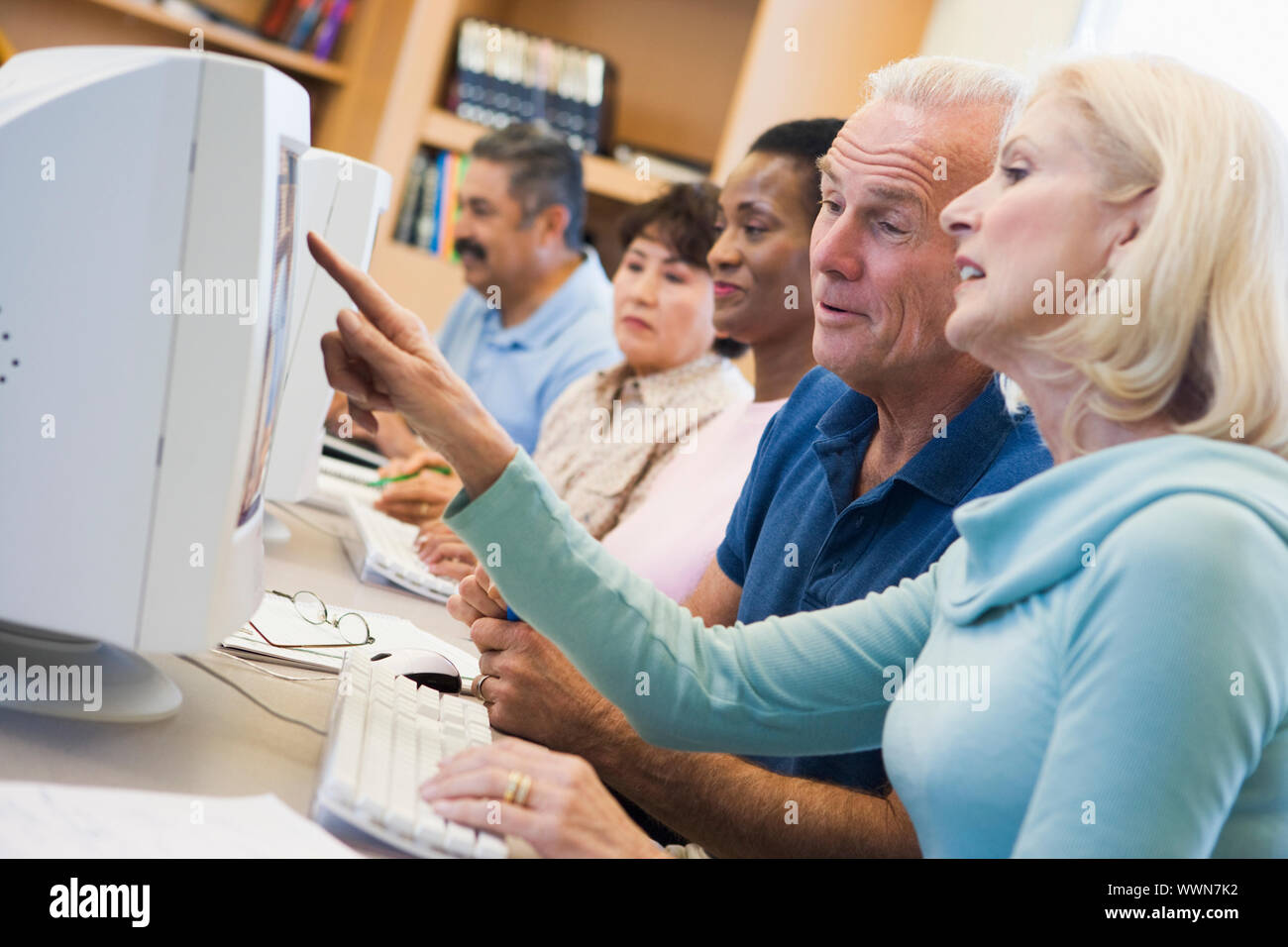 Mature students learning computer skills Stock Photo - Alamy