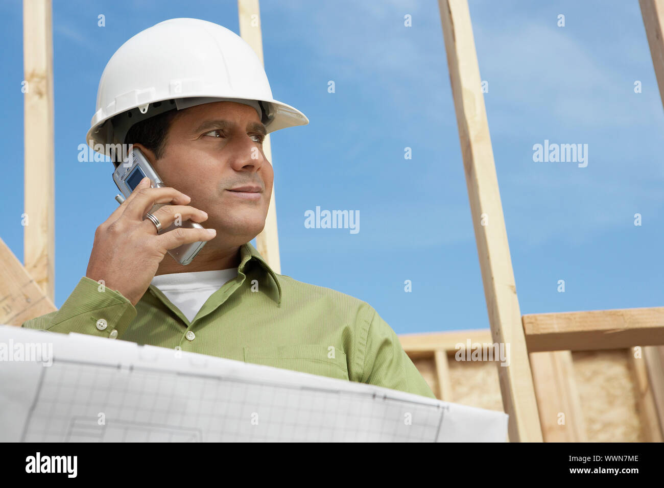 Construction Worker Using Cell Phone Stock Photo - Alamy