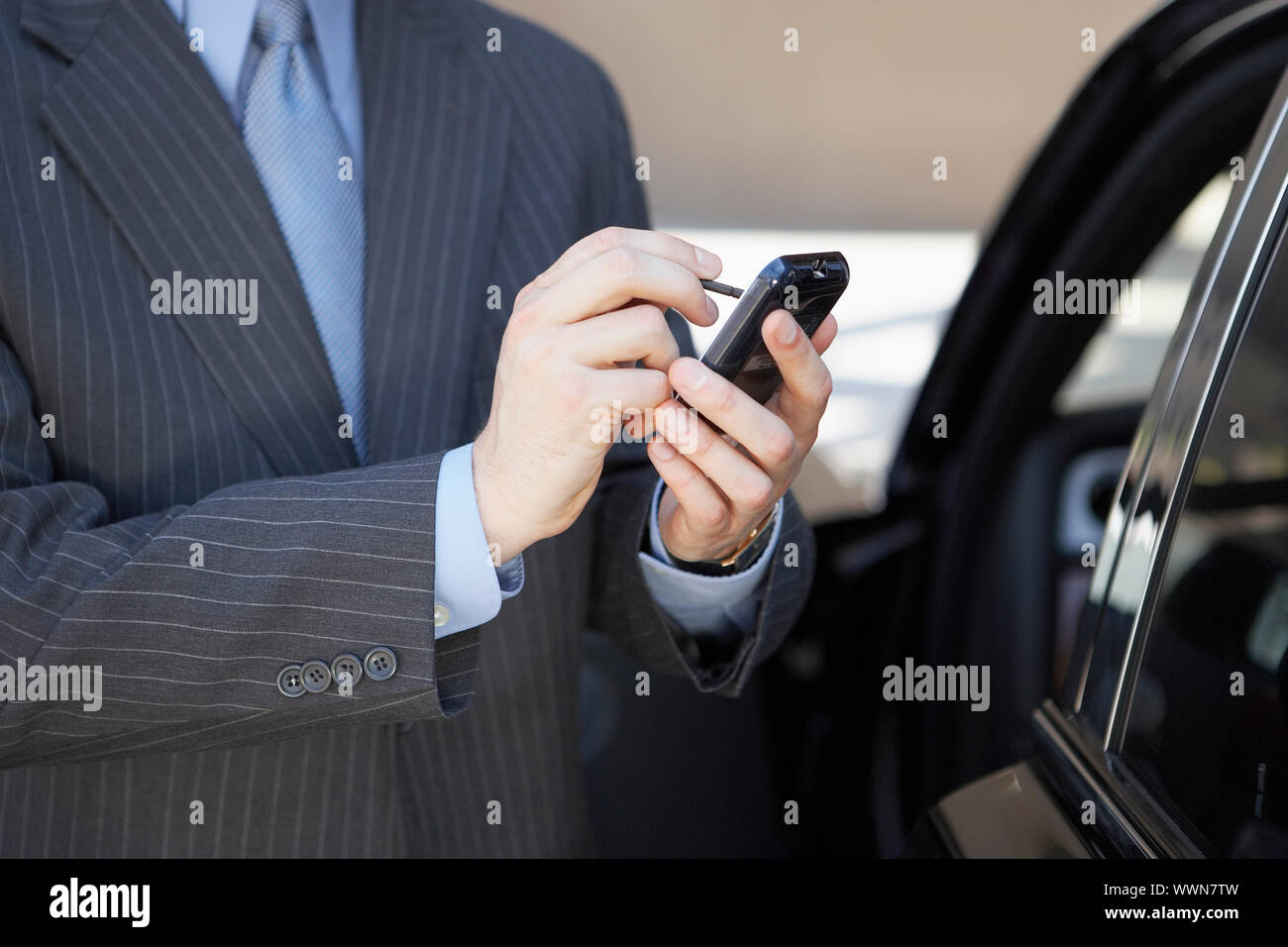 Businessman Using PDA Stock Photo - Alamy