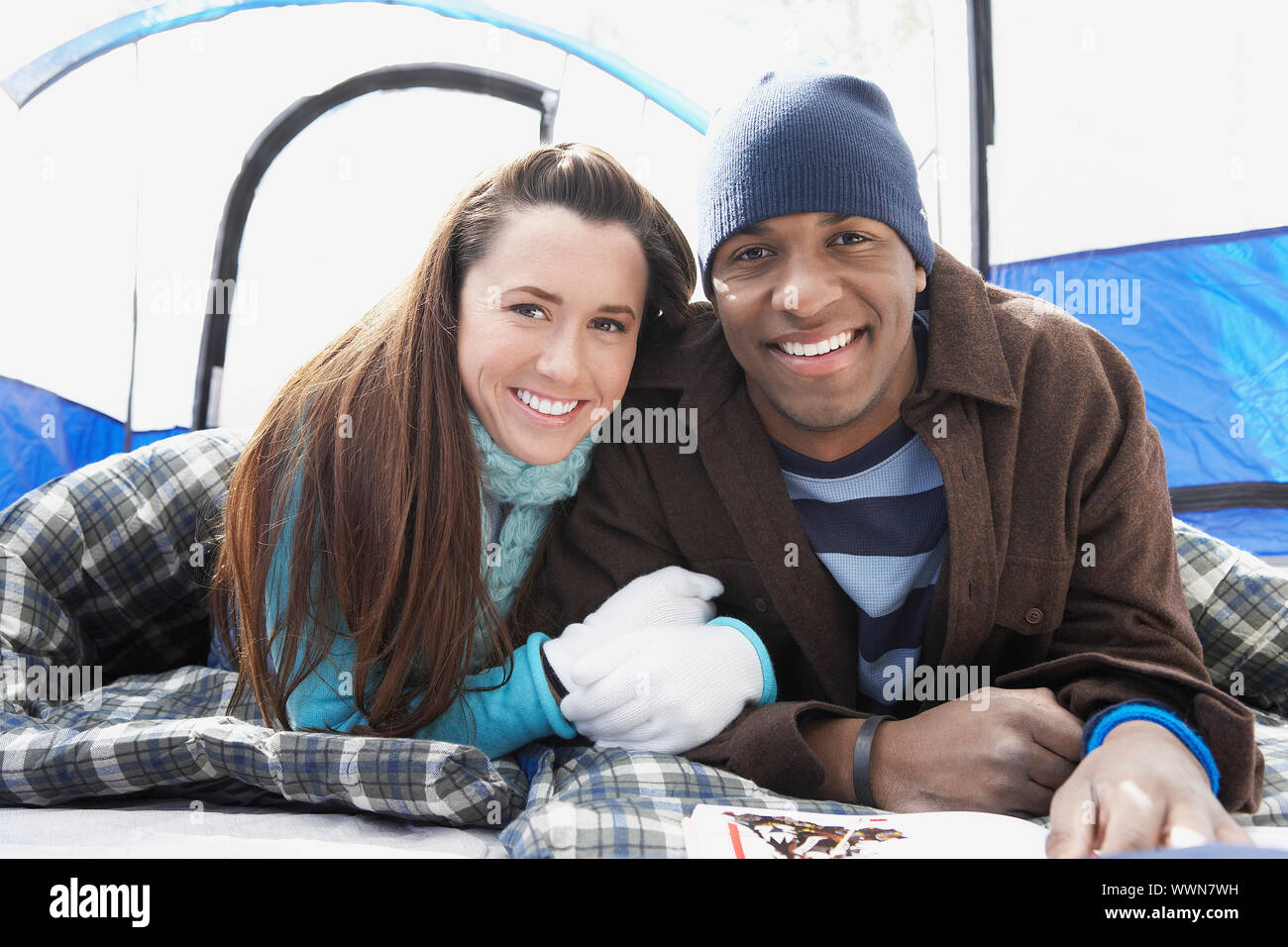 Couple camping cuddling in tent hi-res stock photography and images - Alamy